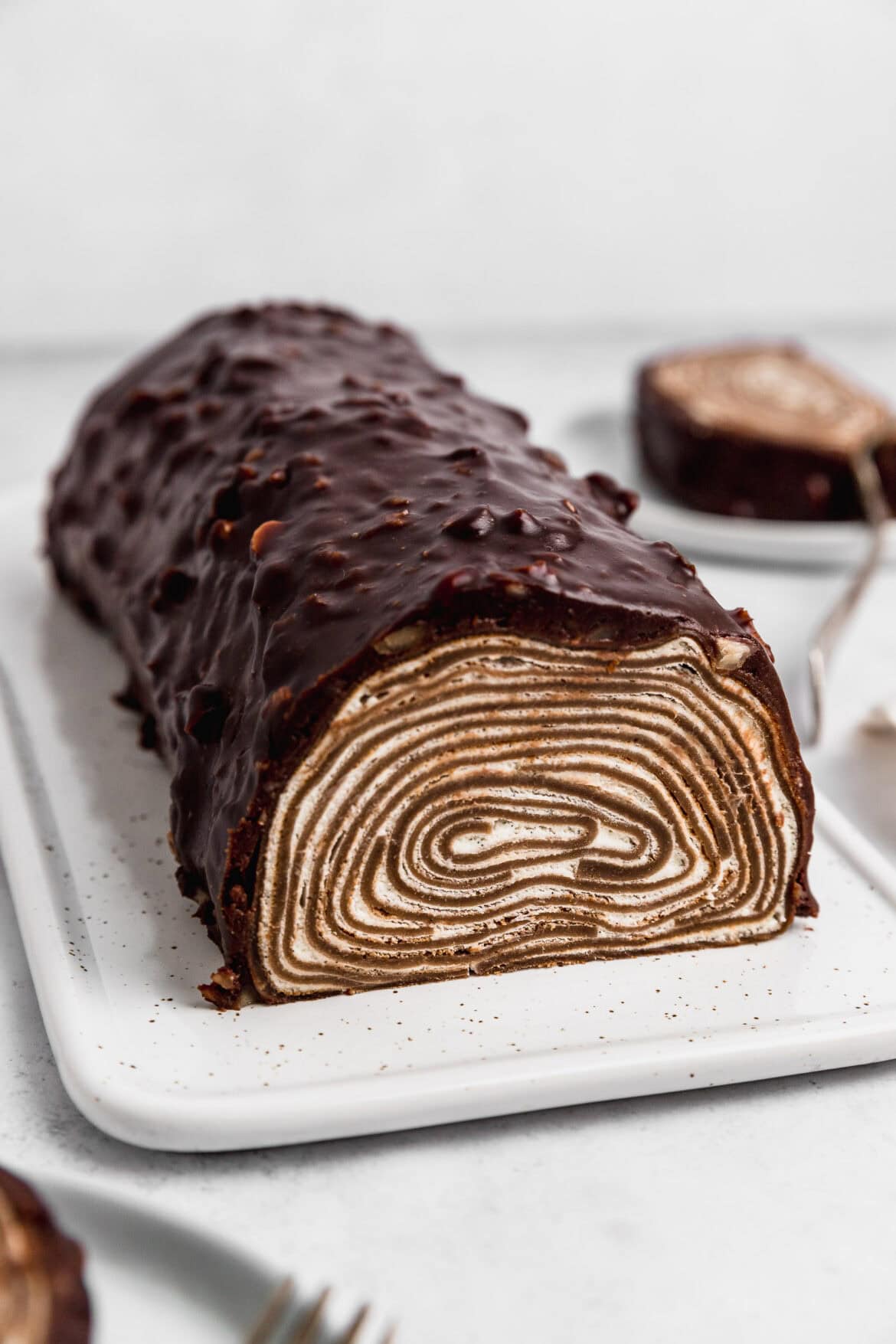 Chocolate Crepe Roll Cake Covered in Ganache | Cravings Journal
