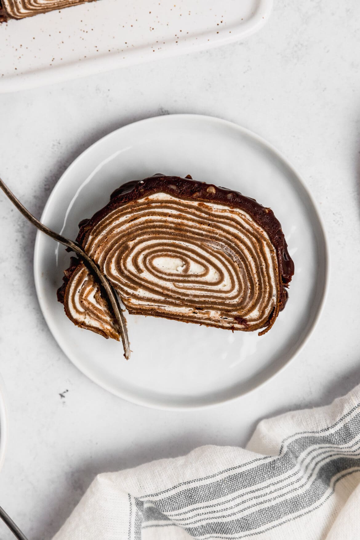 Chocolate Crepe Roll Cake Covered in Ganache | Cravings Journal