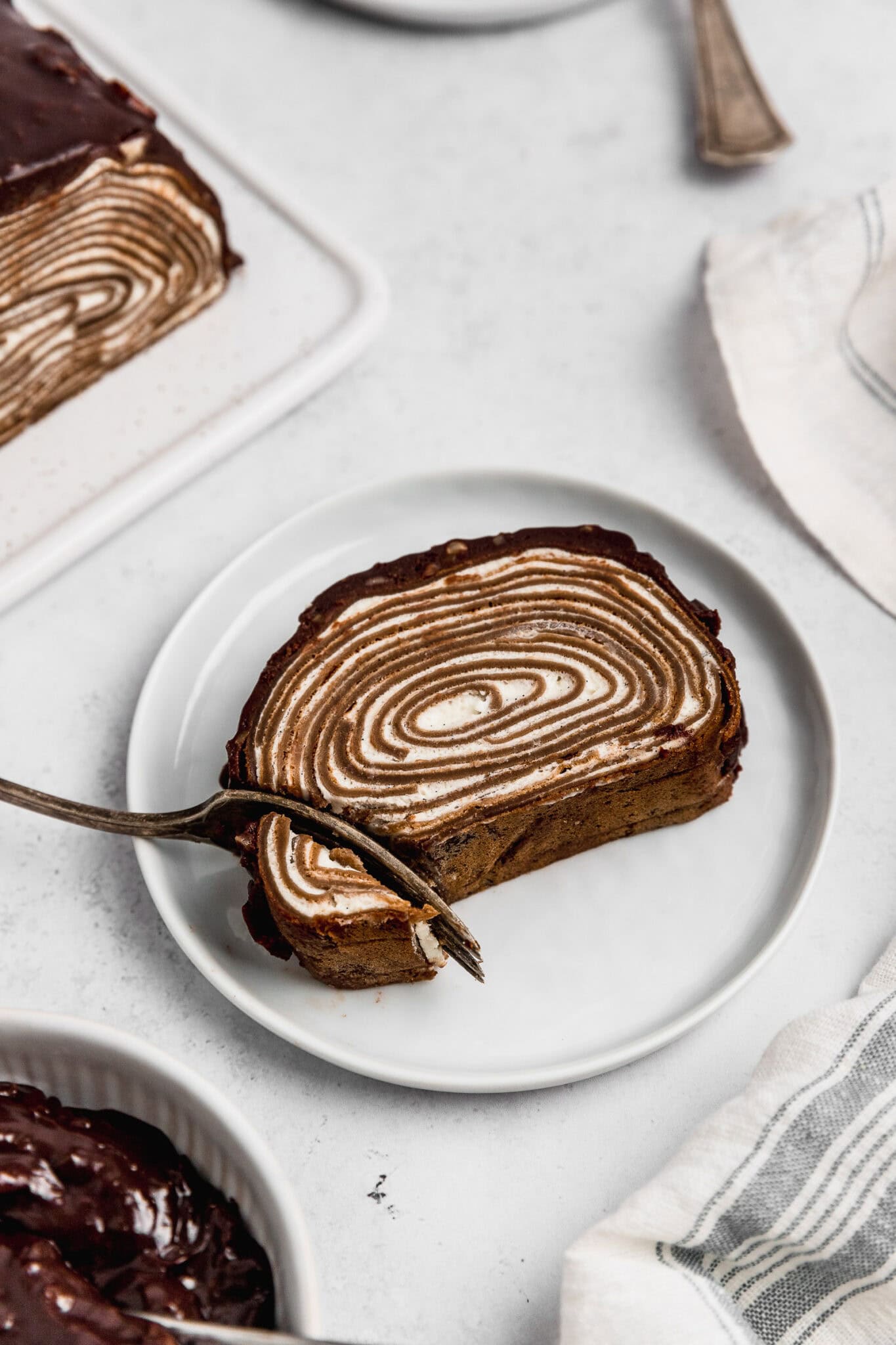 Chocolate Crepe Roll Cake Covered in Ganache | Cravings Journal